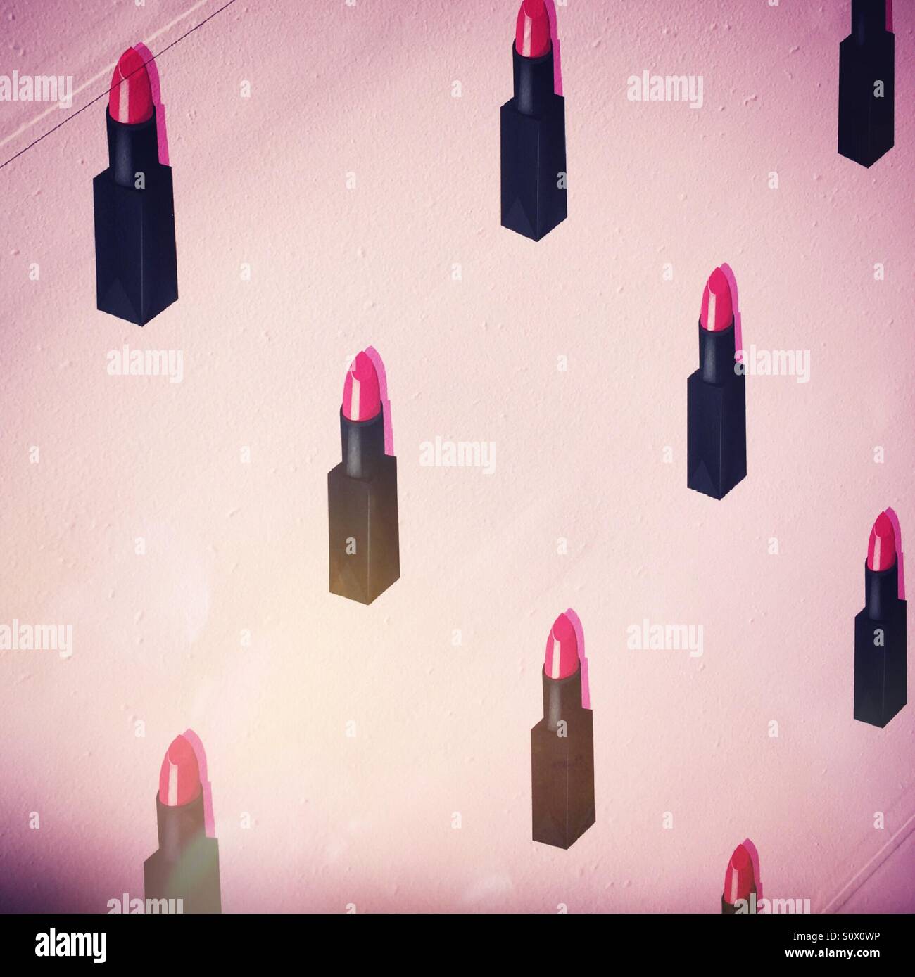 Row of red lipsticks hi-res stock photography and images - Alamy