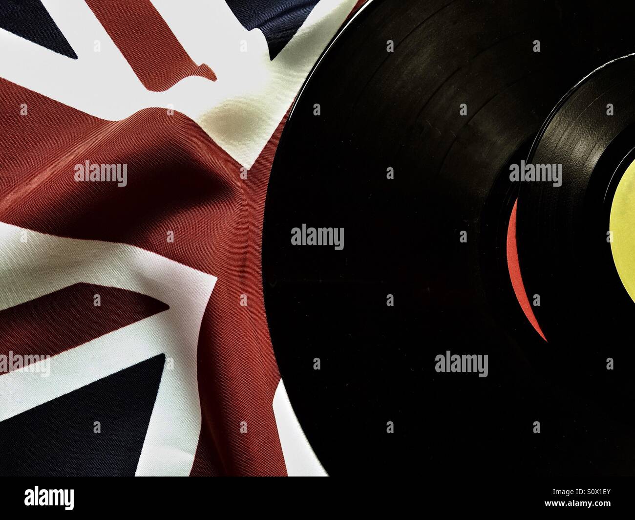 Two vinyl records on UK flag Stock Photo - Alamy