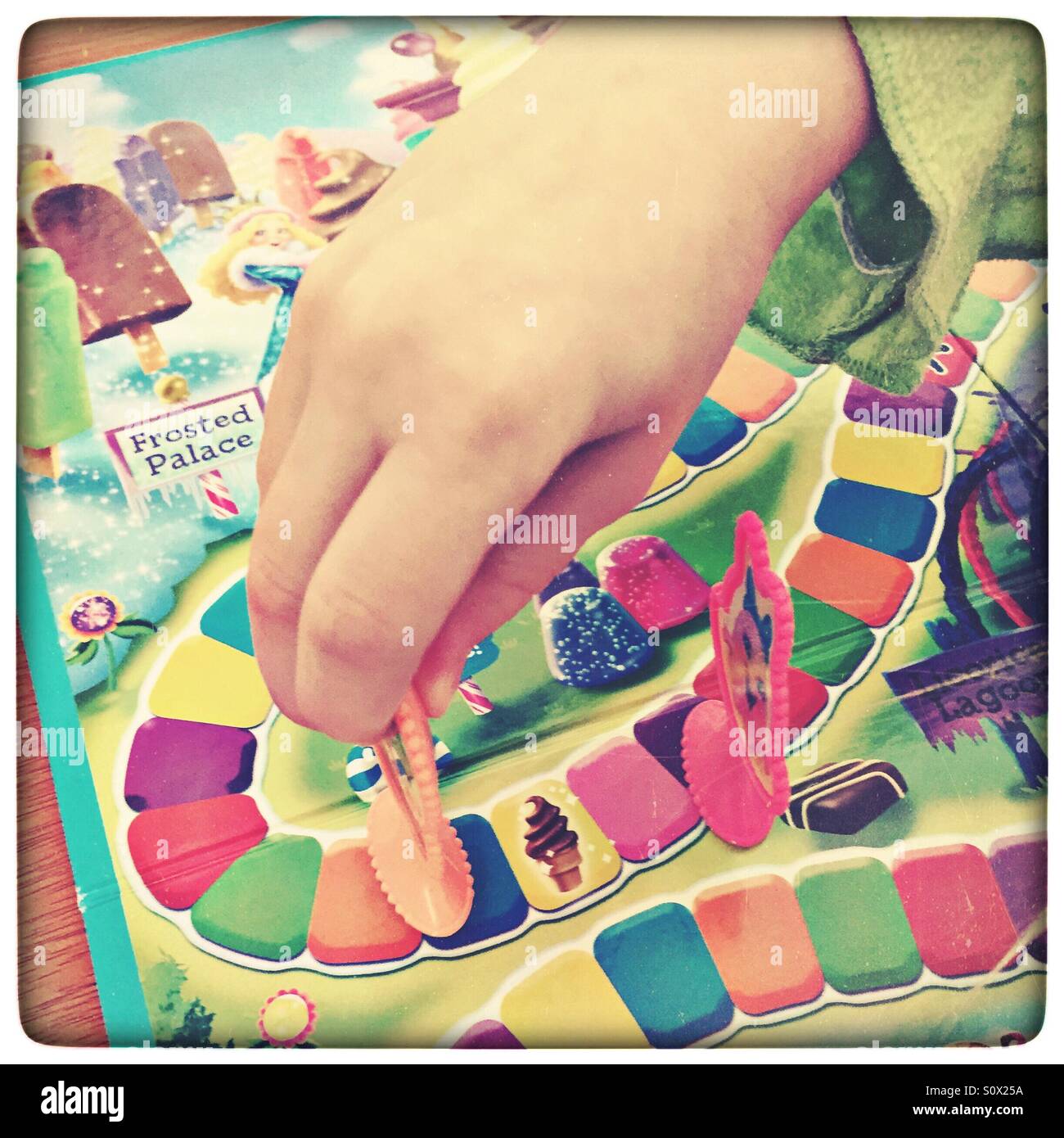 Candy Land children's game, childs hand playing Stock Photo - Alamy