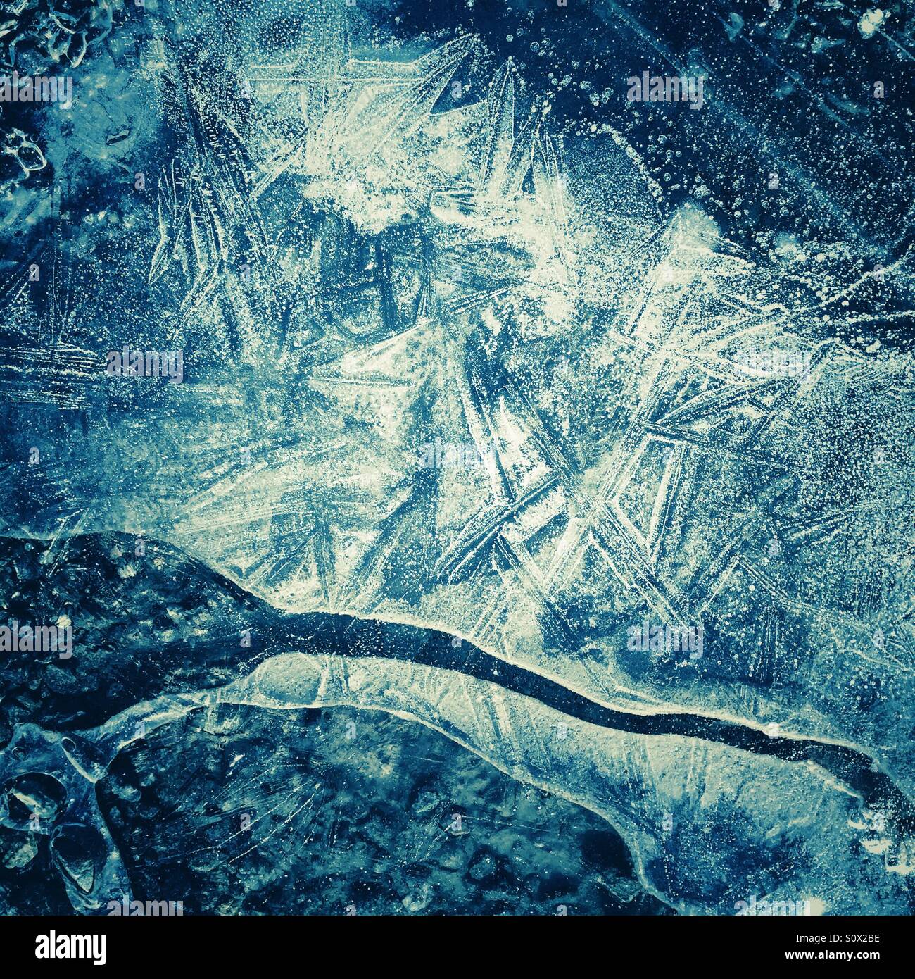 Frozen puddle patterns Stock Photo - Alamy