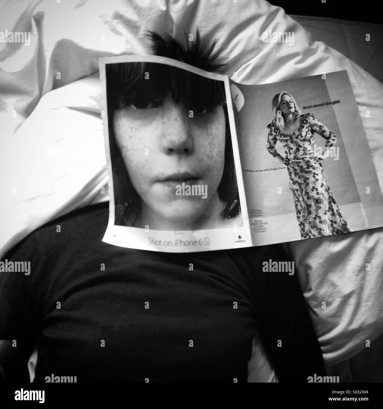 A woman poses with a magazine Stock Photo - Alamy