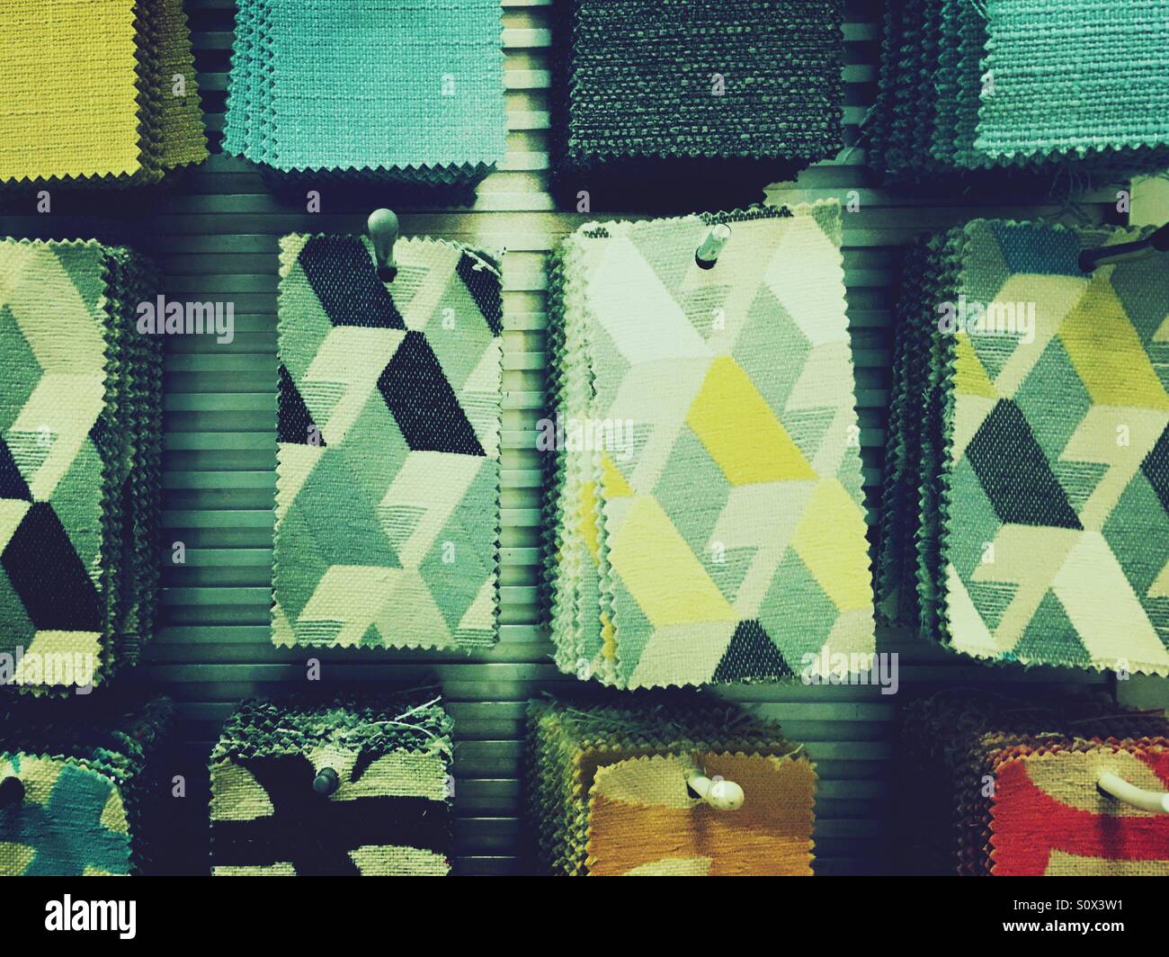 Fabric samples hanging on wall hi-res stock photography and images - Alamy