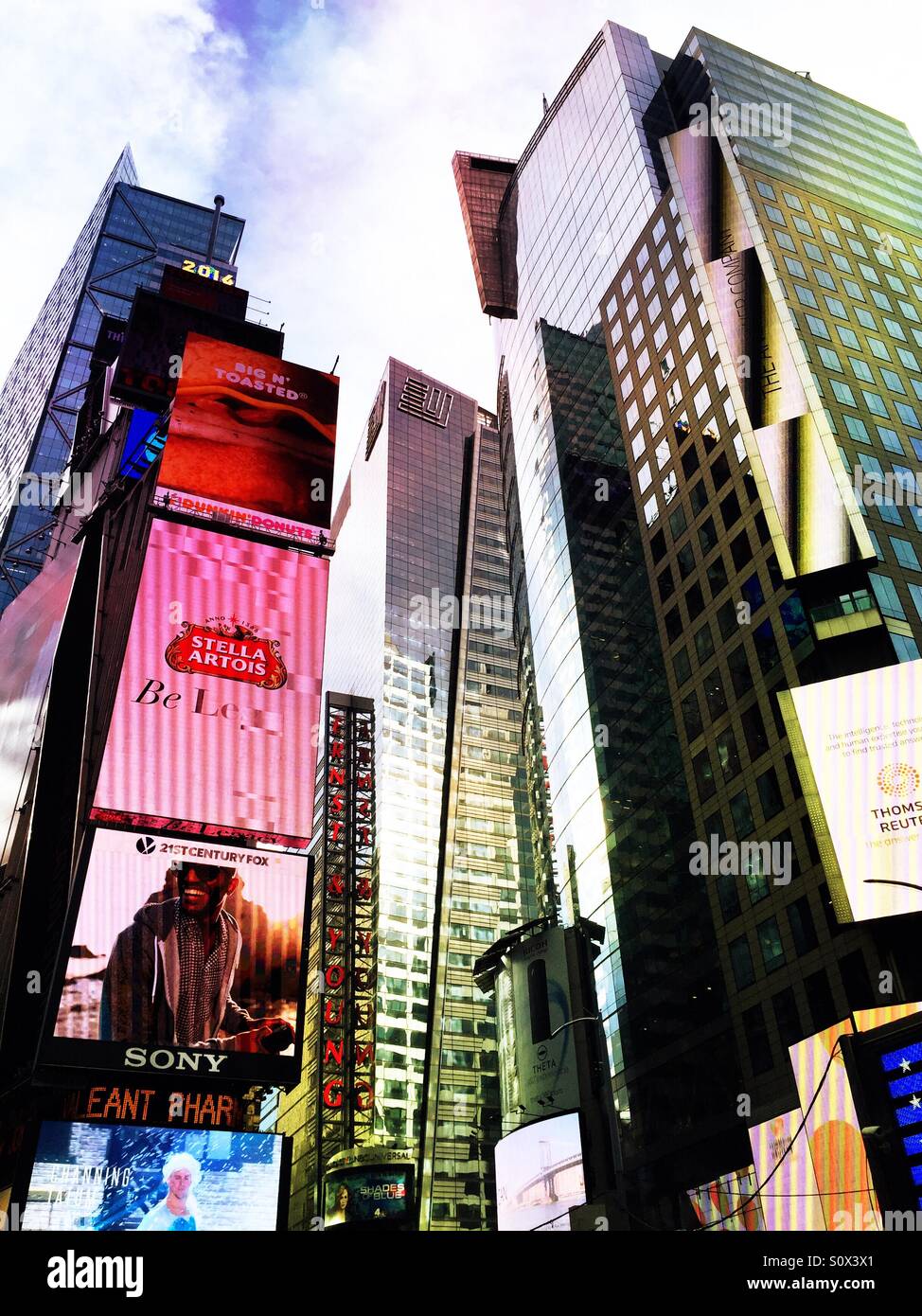 Skyscrapers in times square are covered in electronic billboards in NYC ...