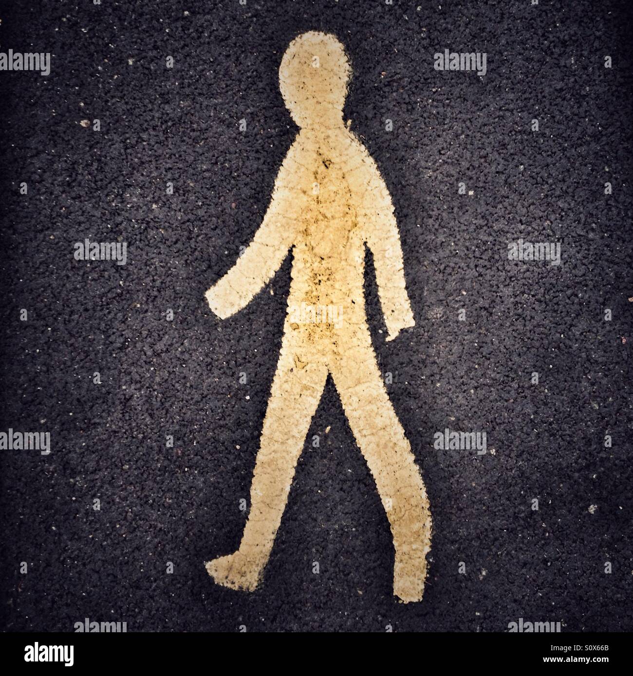 Walking figure road marking Stock Photo - Alamy