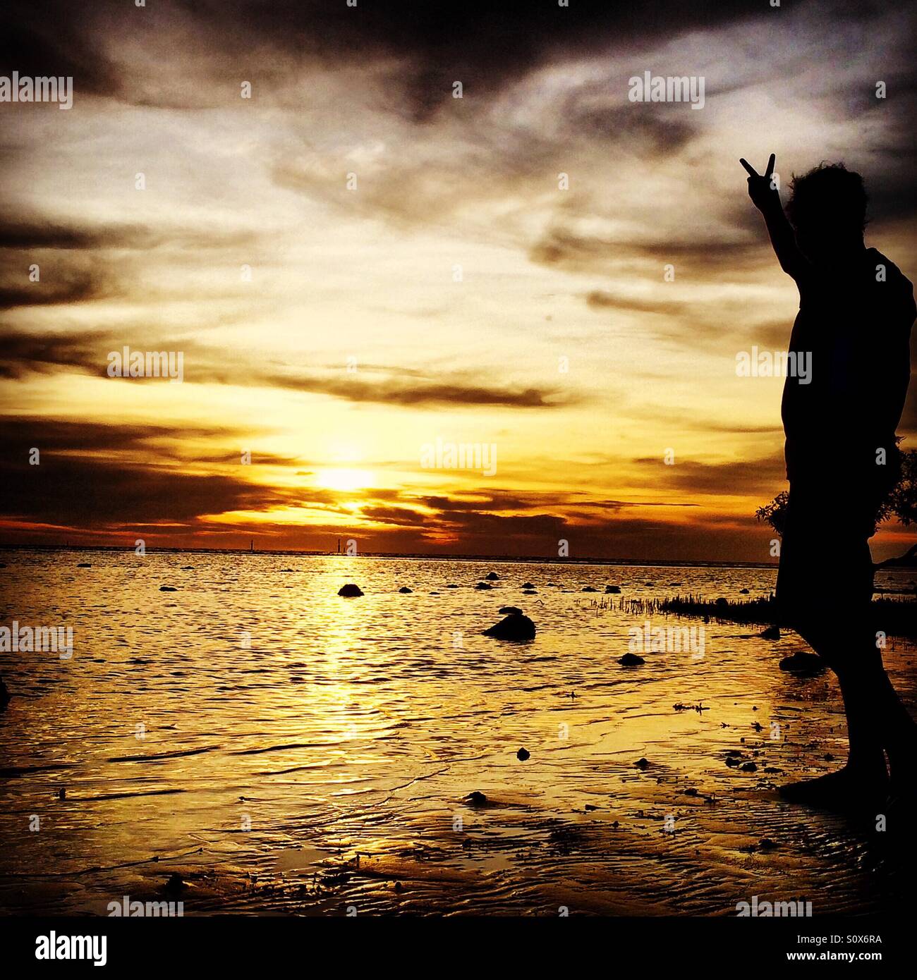 Pointing at the sunset hi-res stock photography and images - Alamy