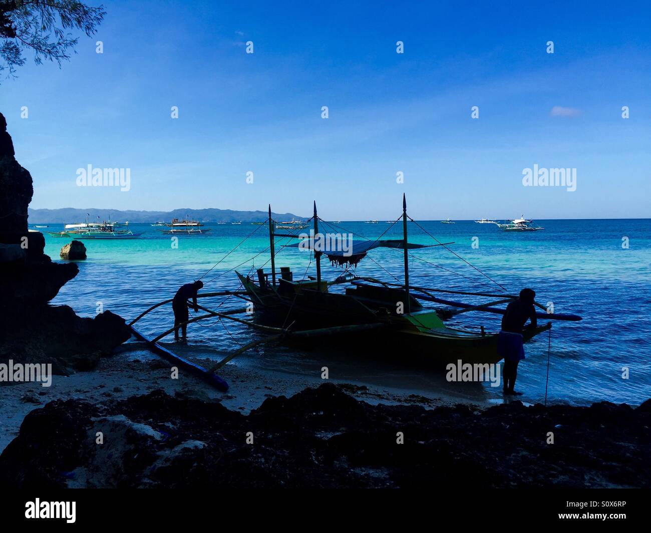 Getting boat ready for fishing Stock Photo - Alamy