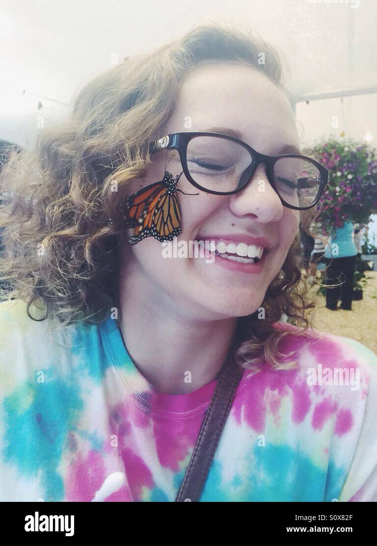 Butterfly on face Stock Photo - Alamy
