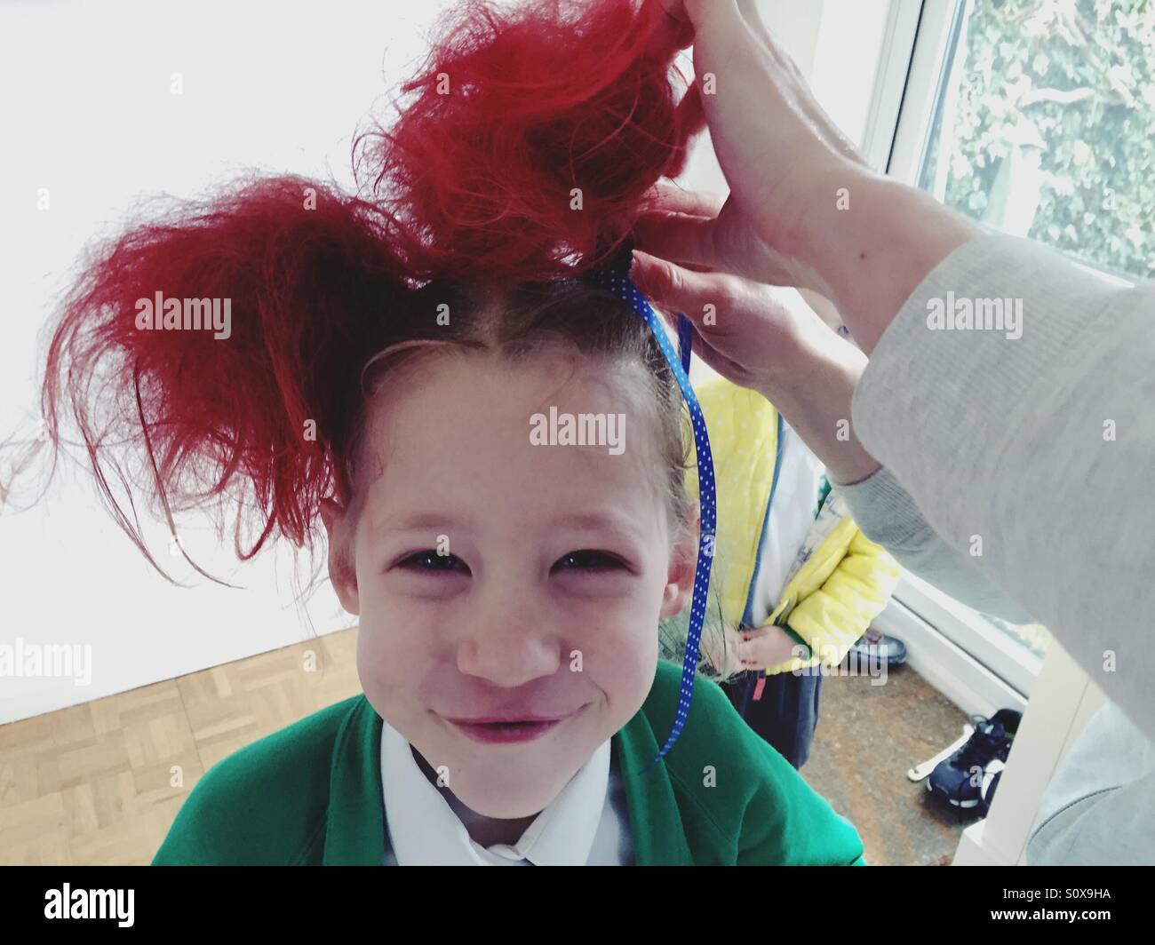 Hair fixed girl Stock Photo - Alamy