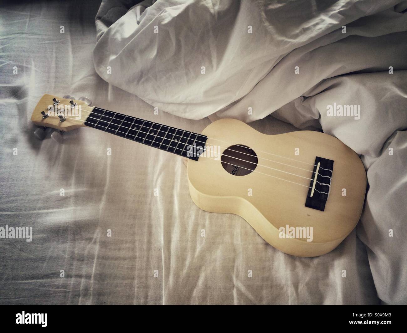 Ukulele in bed Stock Photo - Alamy