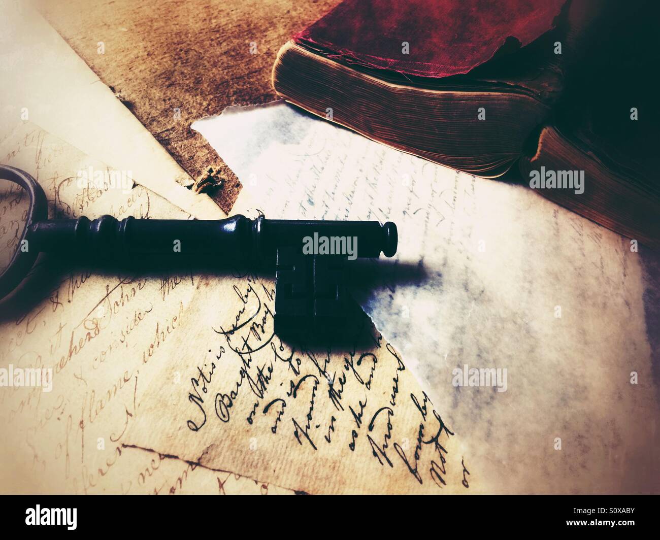 Vintage handwritten documents with key Stock Photo - Alamy
