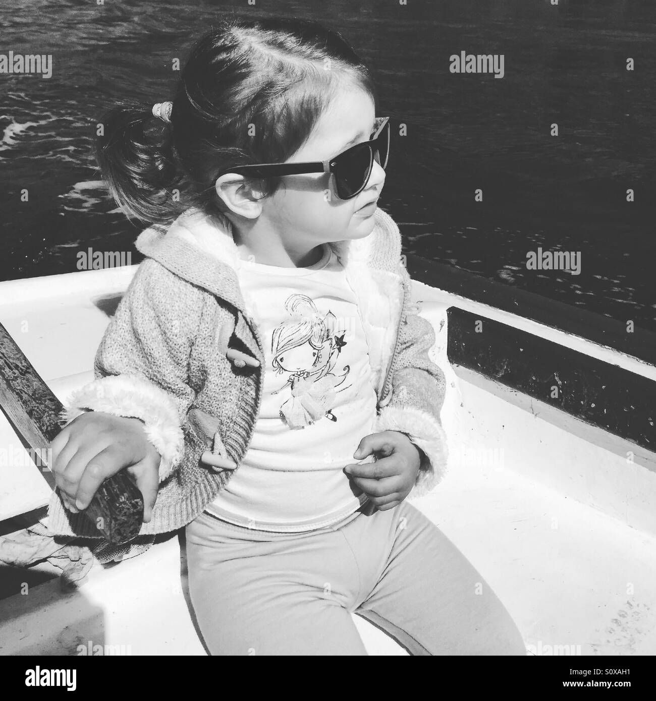 Kid Girl Driving Boat High Resolution Stock Photography and Images - Alamy