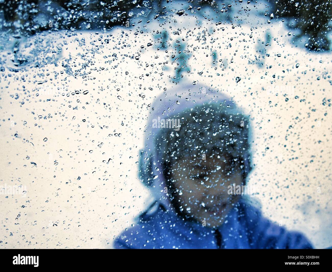 Child outside window in winter in snow Stock Photo - Alamy