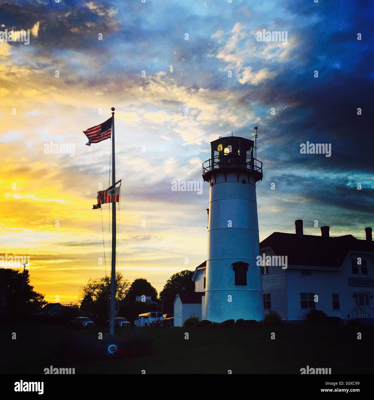 Lighthouse at sunset Stock Photo - Alamy