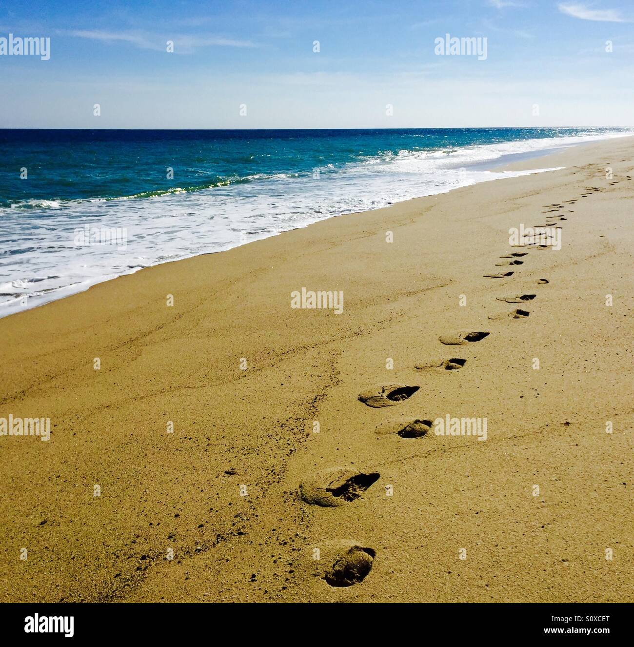 Footsteps on the beach Stock Photo - Alamy