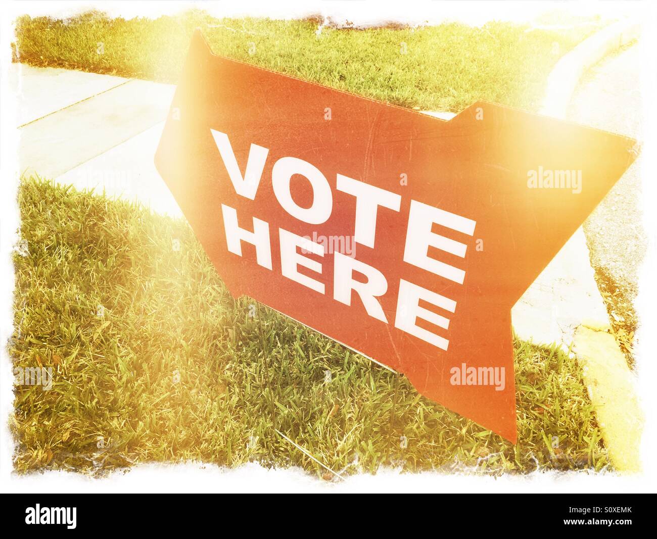Vote Here sign Stock Photo - Alamy