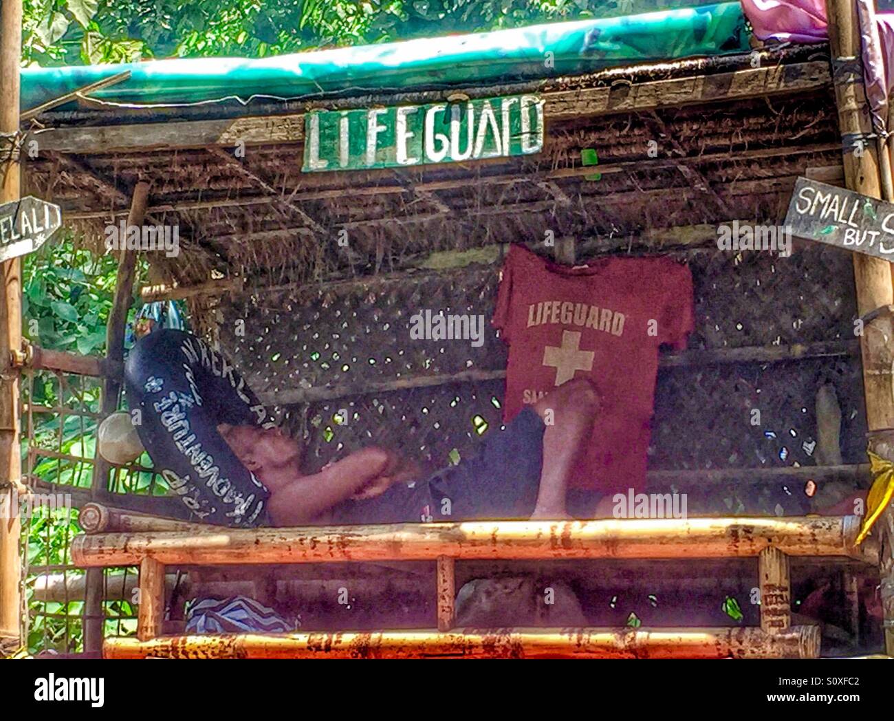 Lifeguard sleeping on duty Stock Photo - Alamy
