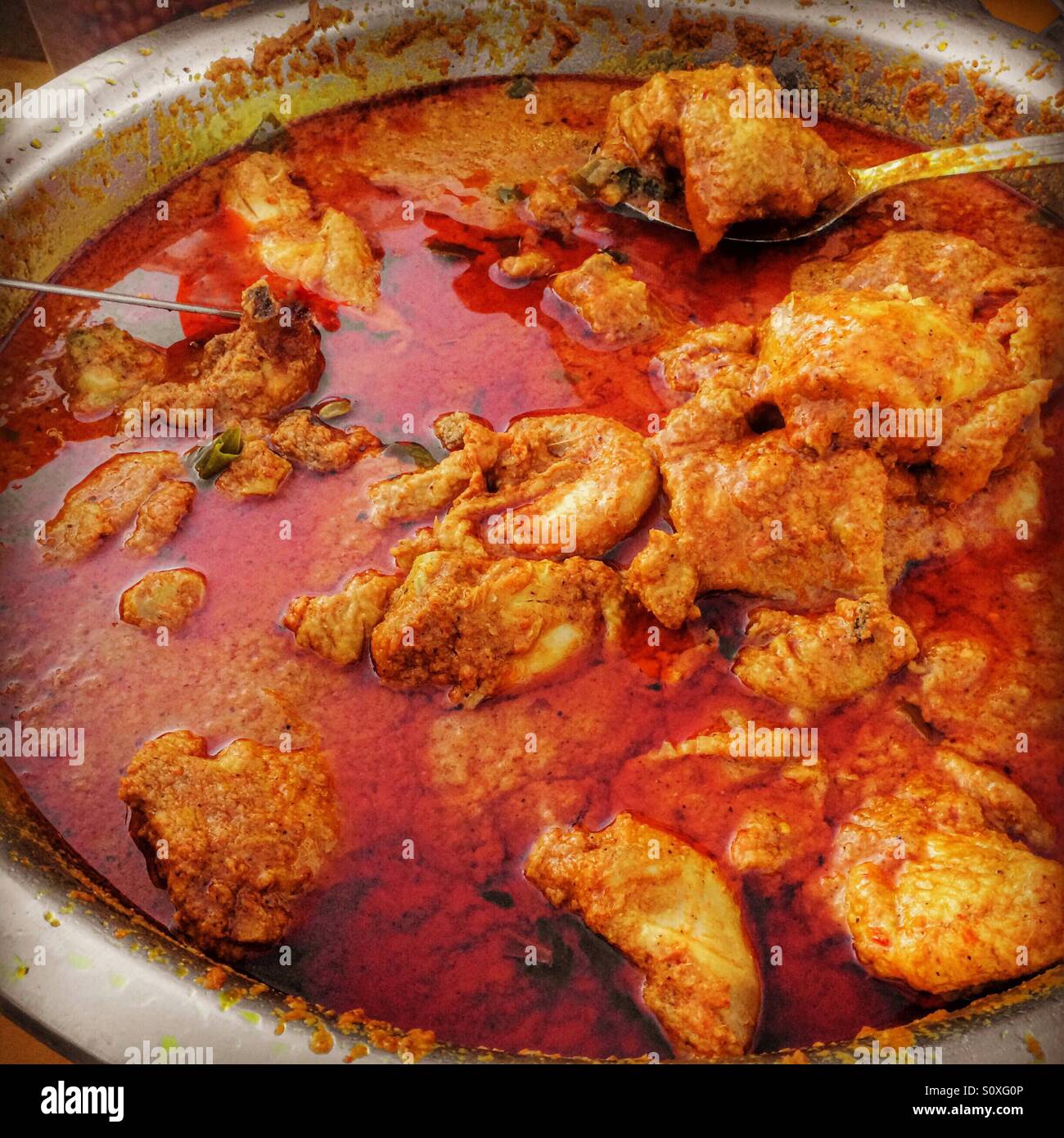 A large pot of curry chicken Stock Photo - Alamy