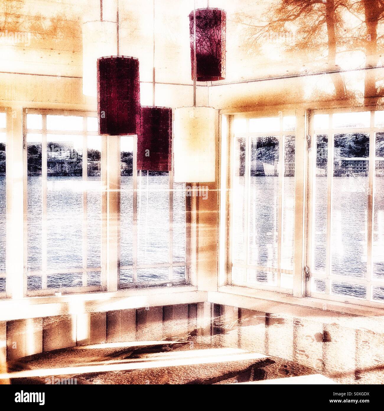 View through windows of waterfront glasshouse, Stockholm, Sweden ...