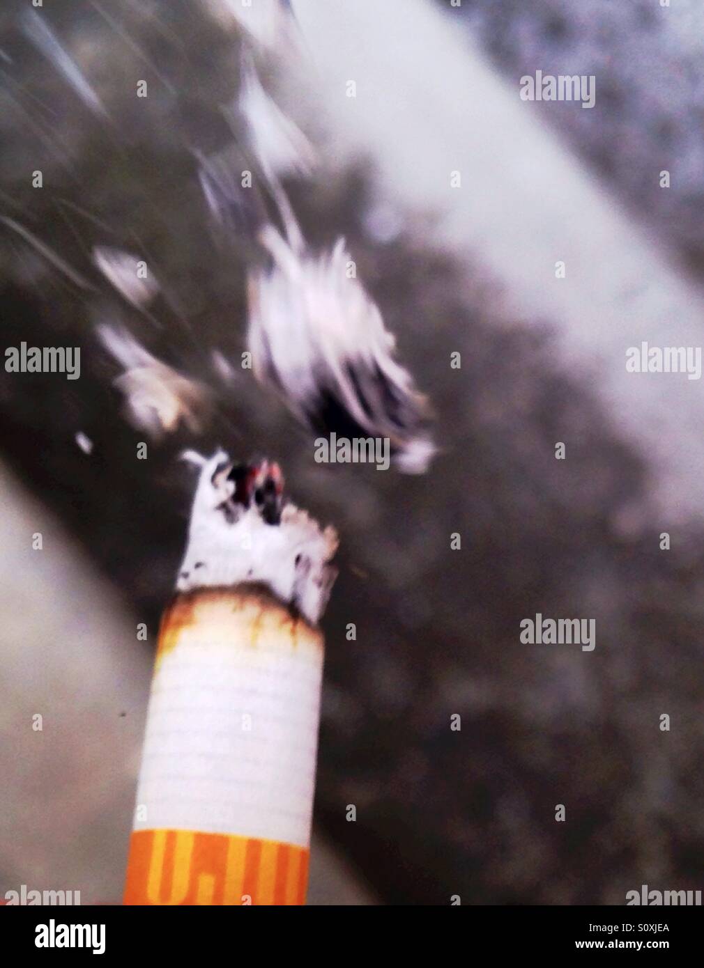 throwing cigarette ash Stock Photo - Alamy
