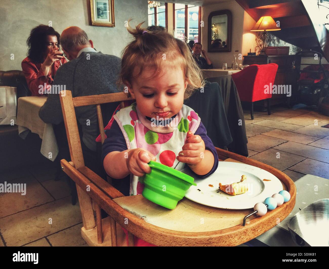 Baby eating alone hi-res stock photography and images - Alamy