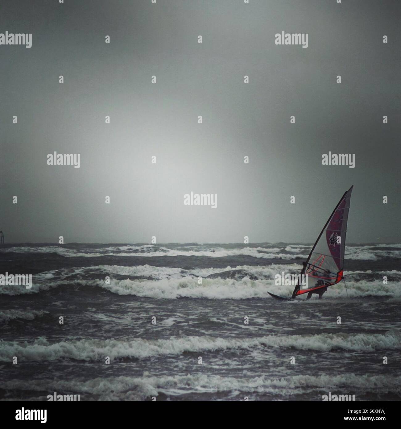 A windsurfer at West Wittering beach in West Sussex, England Stock ...