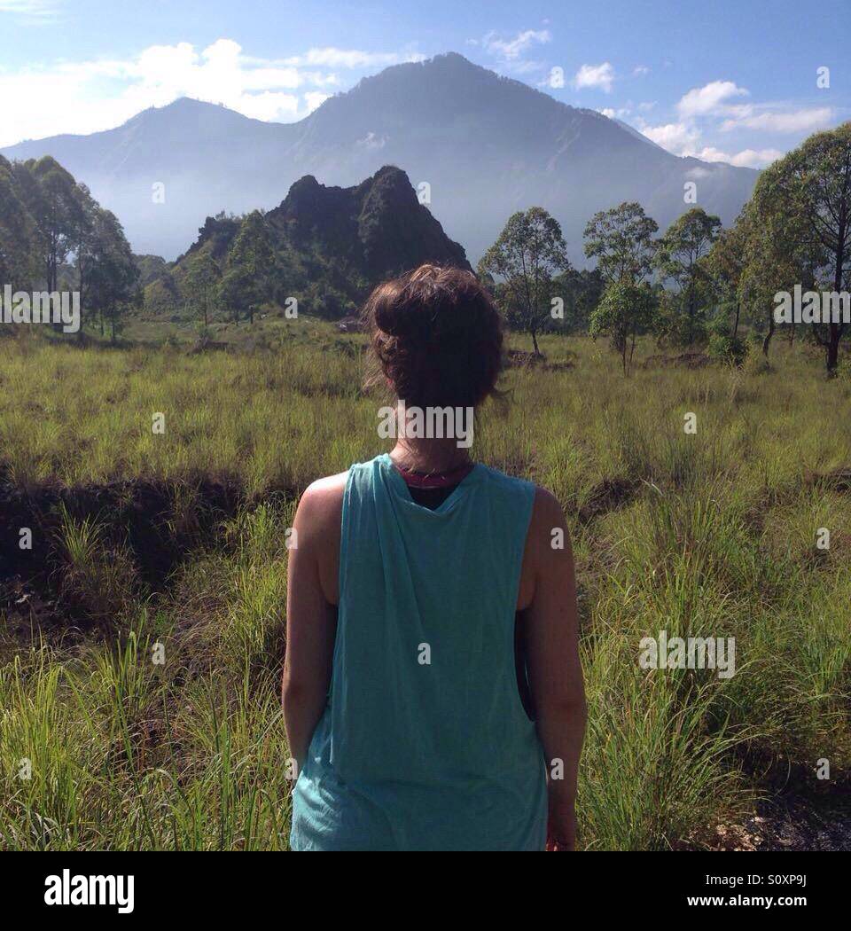 Reflecting after a trek up a volcano in Bali Stock Photo - Alamy