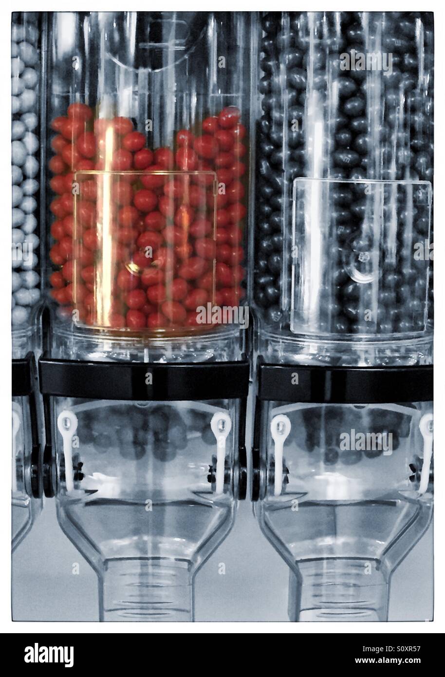 Red candy dispenser Stock Photo - Alamy