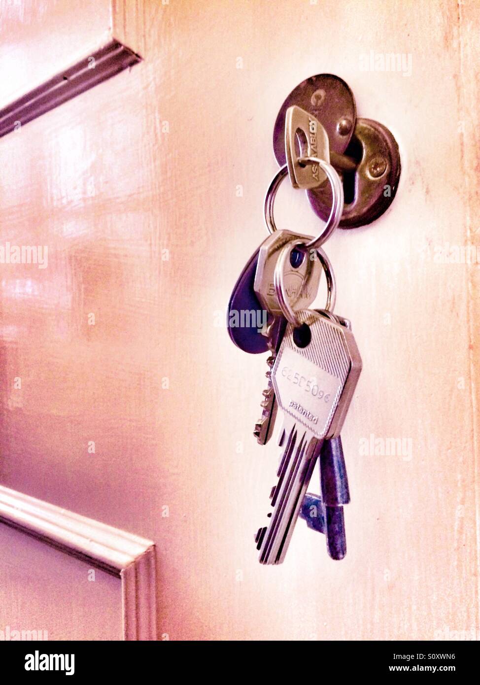Key in door Stock Photo - Alamy