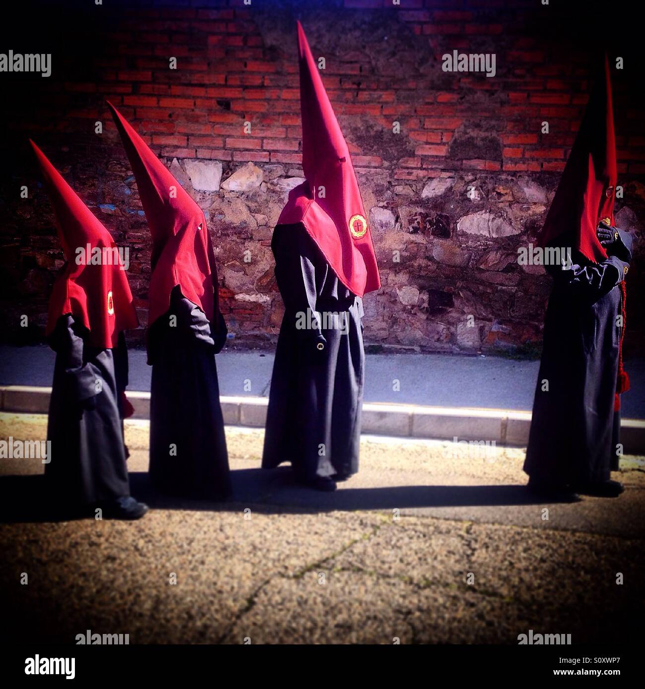 Red pointed hoods hi-res stock photography and images - Alamy