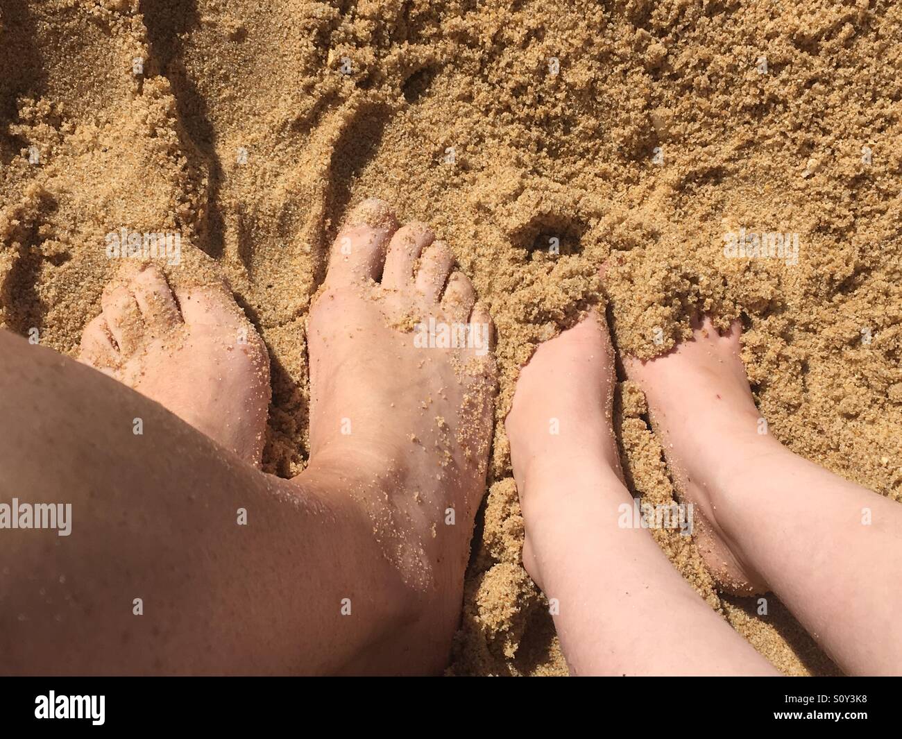 Feet buried sand hi-res stock photography and images - Alamy
