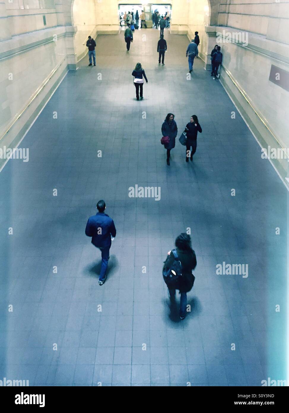 Travelers move up a ramp in Grand Central terminal, New York City, USA ...