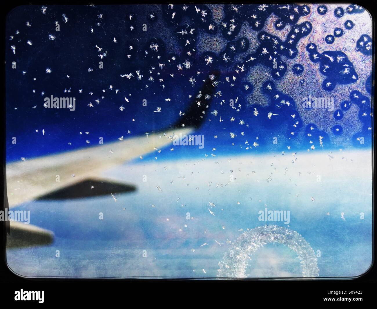 Frost on airplane window Stock Photo - Alamy