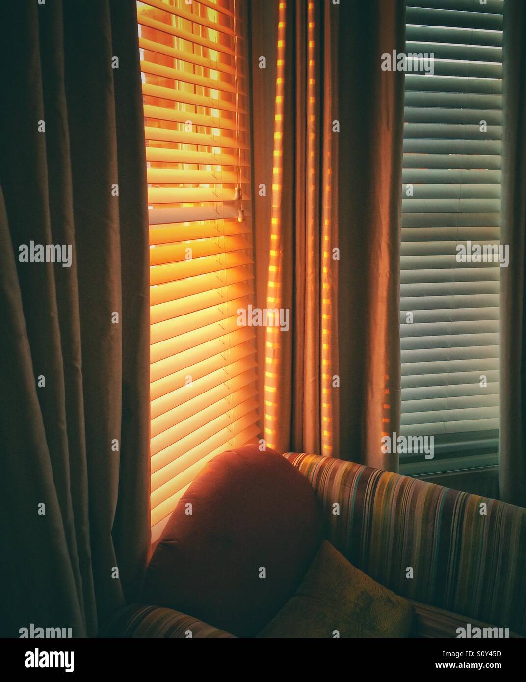 Sunshine on a set of blinds Stock Photo - Alamy
