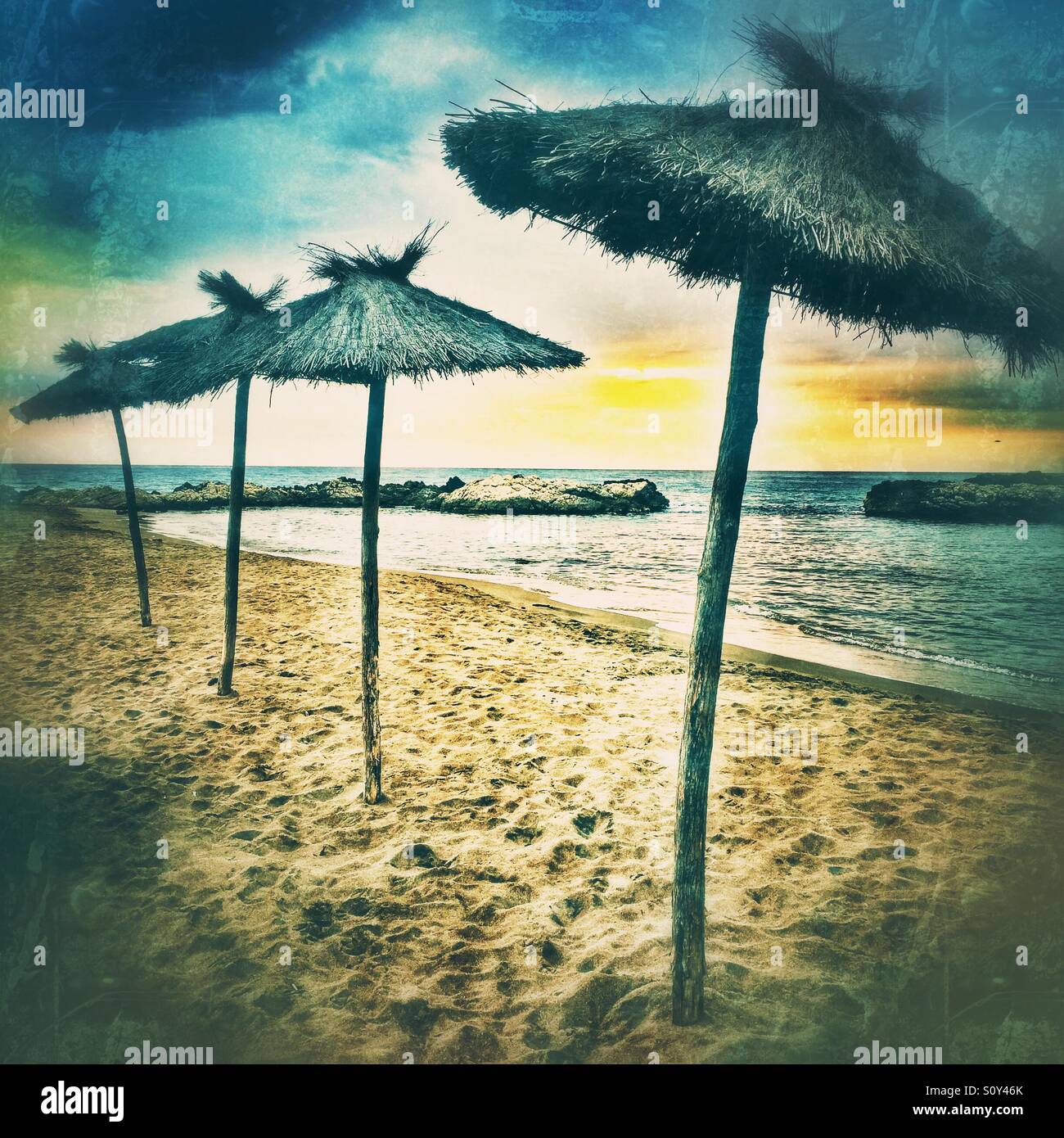 Setting sun beach umbrellas hi-res stock photography and images - Alamy