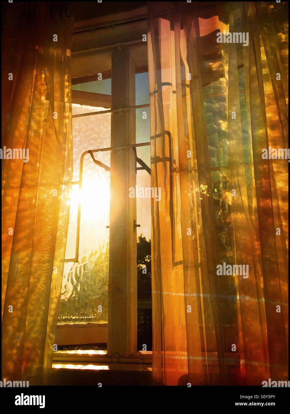 Sunlight shining through curtain Stock Photo - Alamy