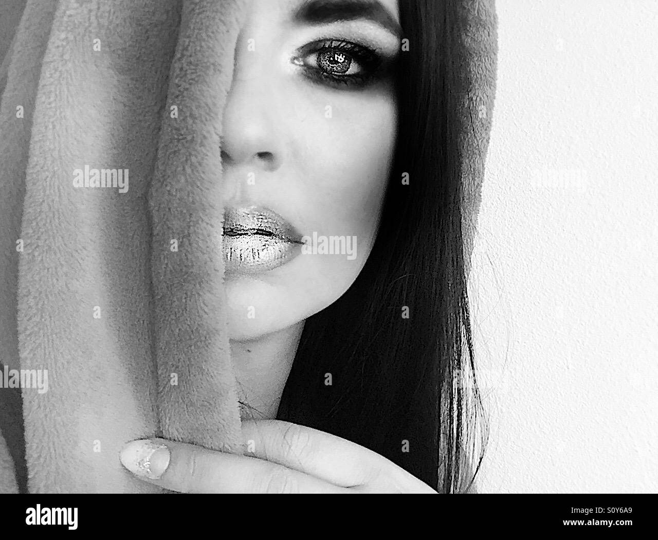 Black and white closeup of beautiful woman looking into camera, half ...