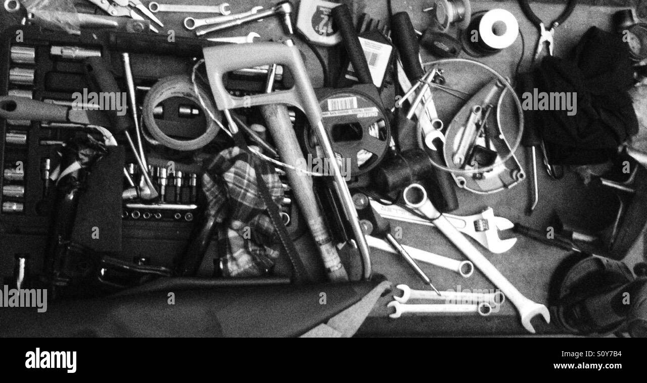 Messy collection of tools on work bench Stock Photo - Alamy