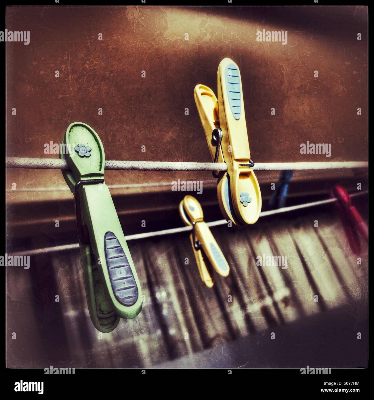 Pegs on washing line Stock Photo - Alamy