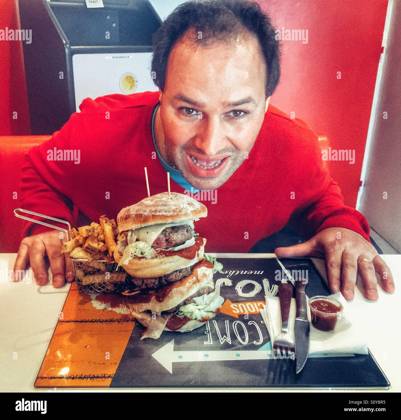 Man enjoying fast food Stock Photo - Alamy
