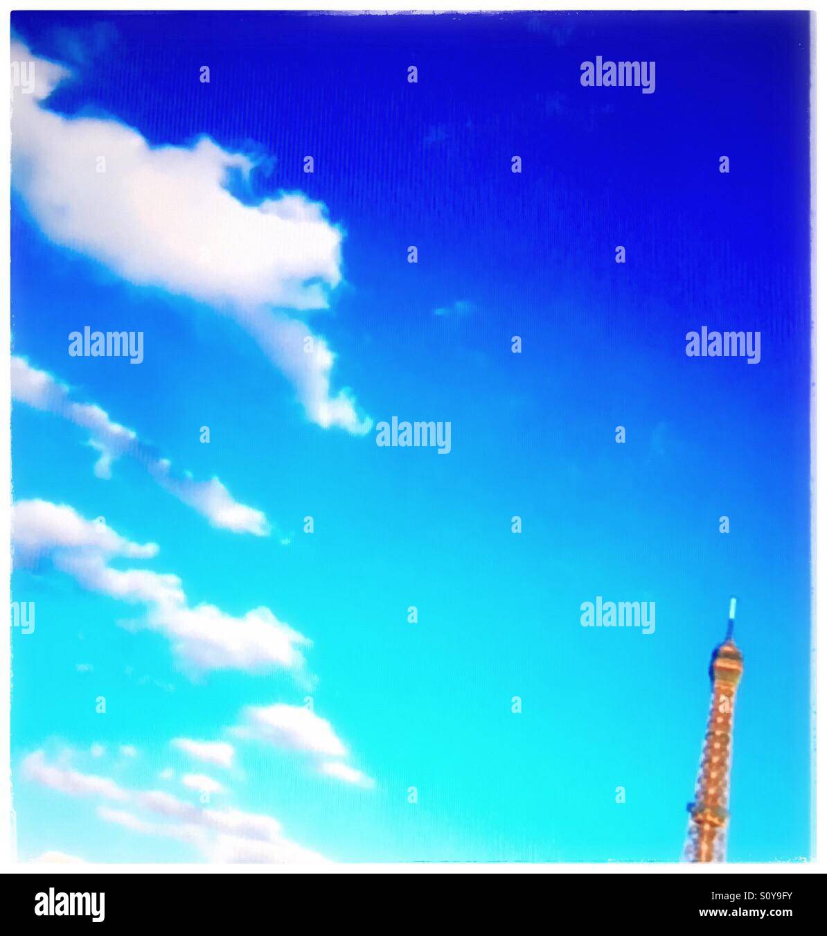 Clouds and the tip top of the Eiffel Tower Stock Photo - Alamy