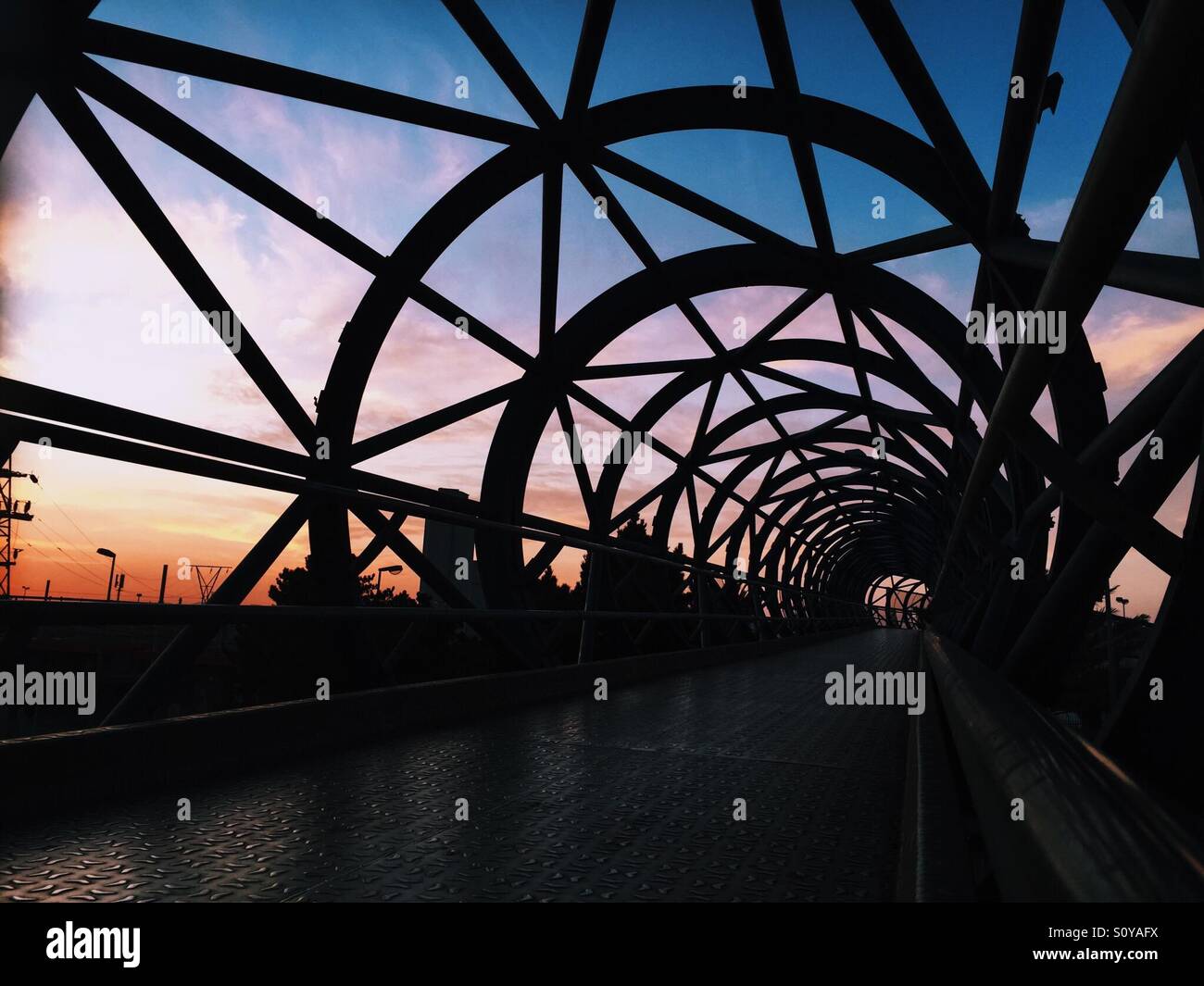 Dynamic Bridge in colourful sunrise Stock Photo - Alamy