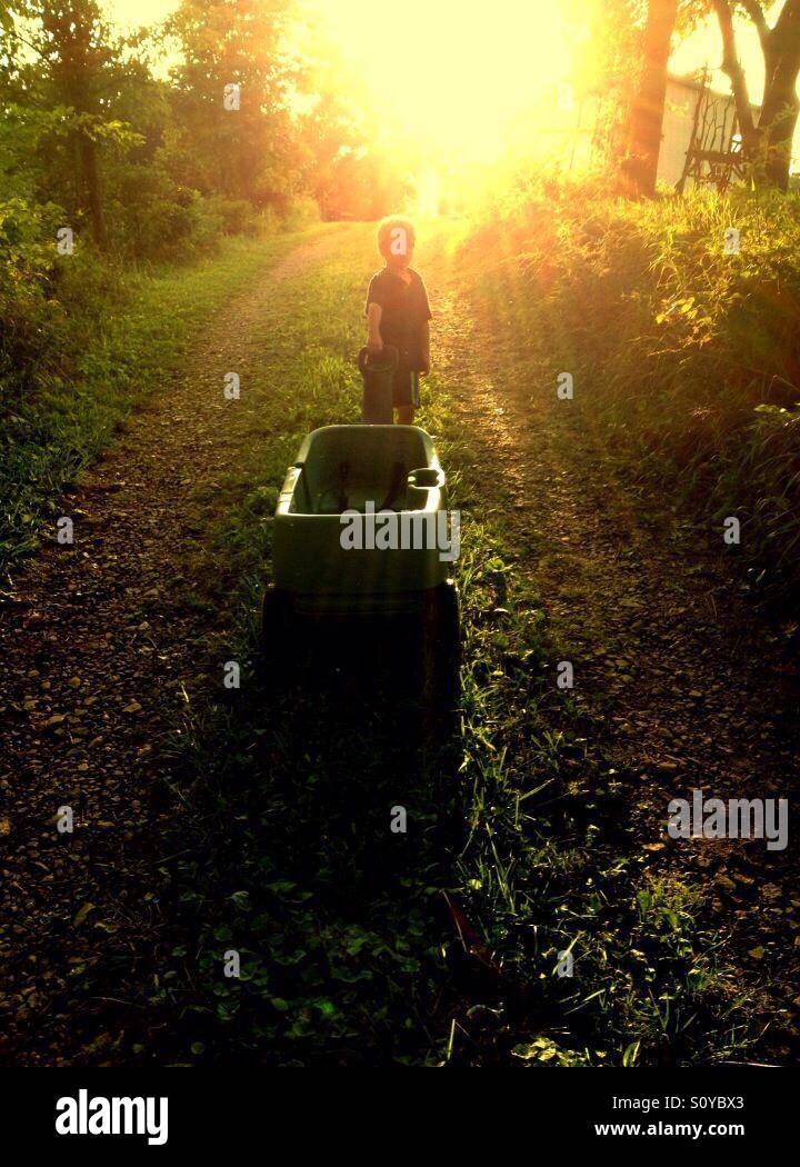 Boy pulling wagon hi-res stock photography and images - Alamy