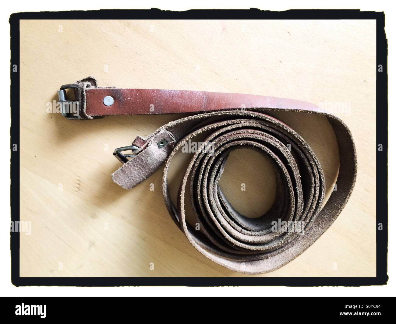 Two old leather belts Stock Photo - Alamy