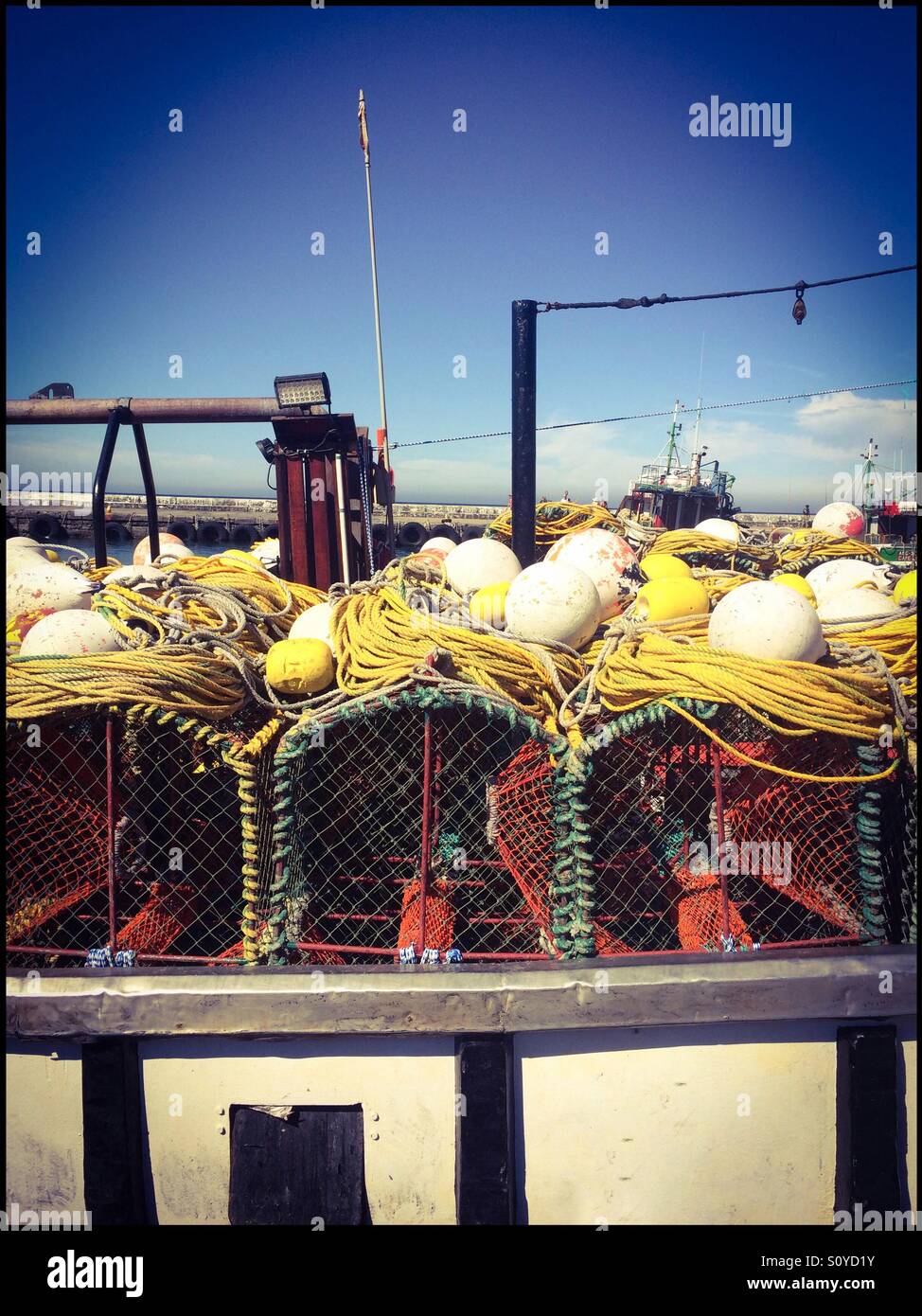 Crayfish pods on fishing trawler in Kalk Bay harbour Stock Photo - Alamy