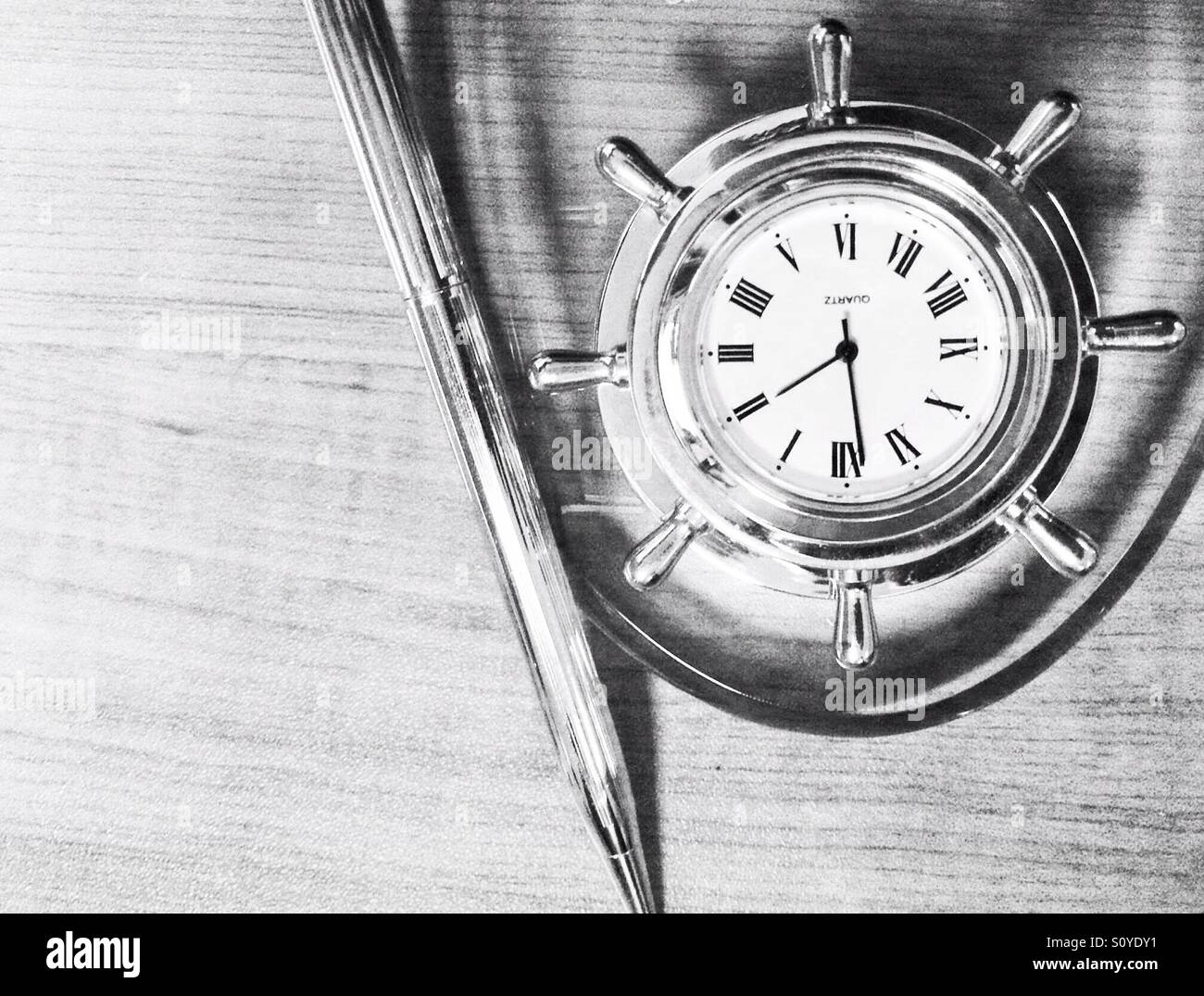 Pen and the watch Stock Photo - Alamy