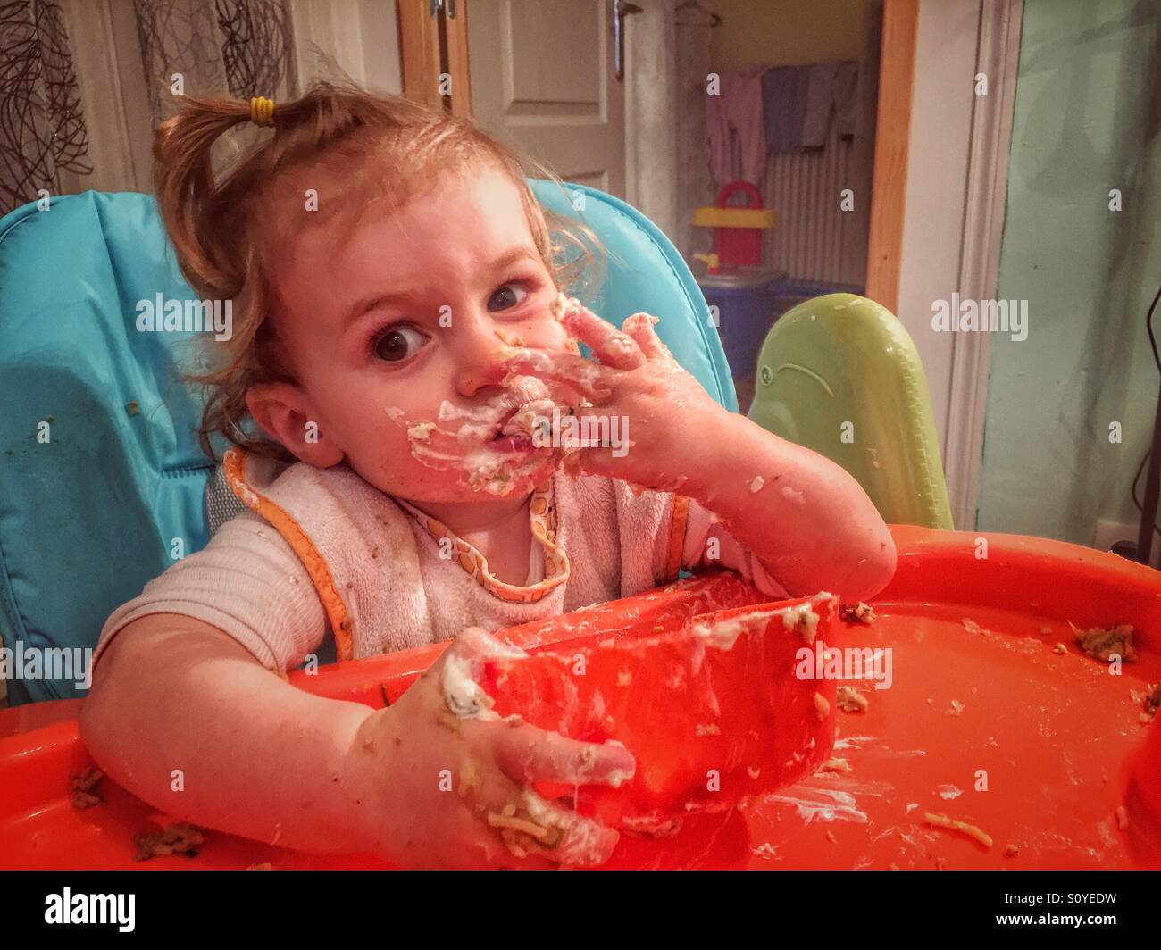 Baby messy face Stock Photo - Alamy