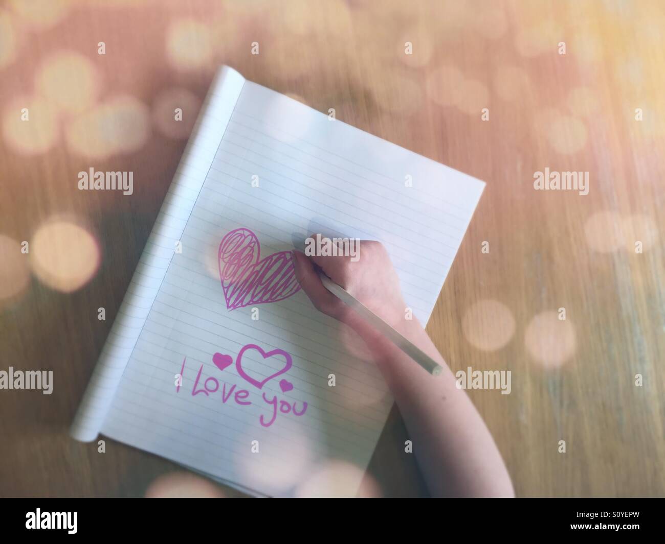 Child writing with pencil hi-res stock photography and images - Alamy