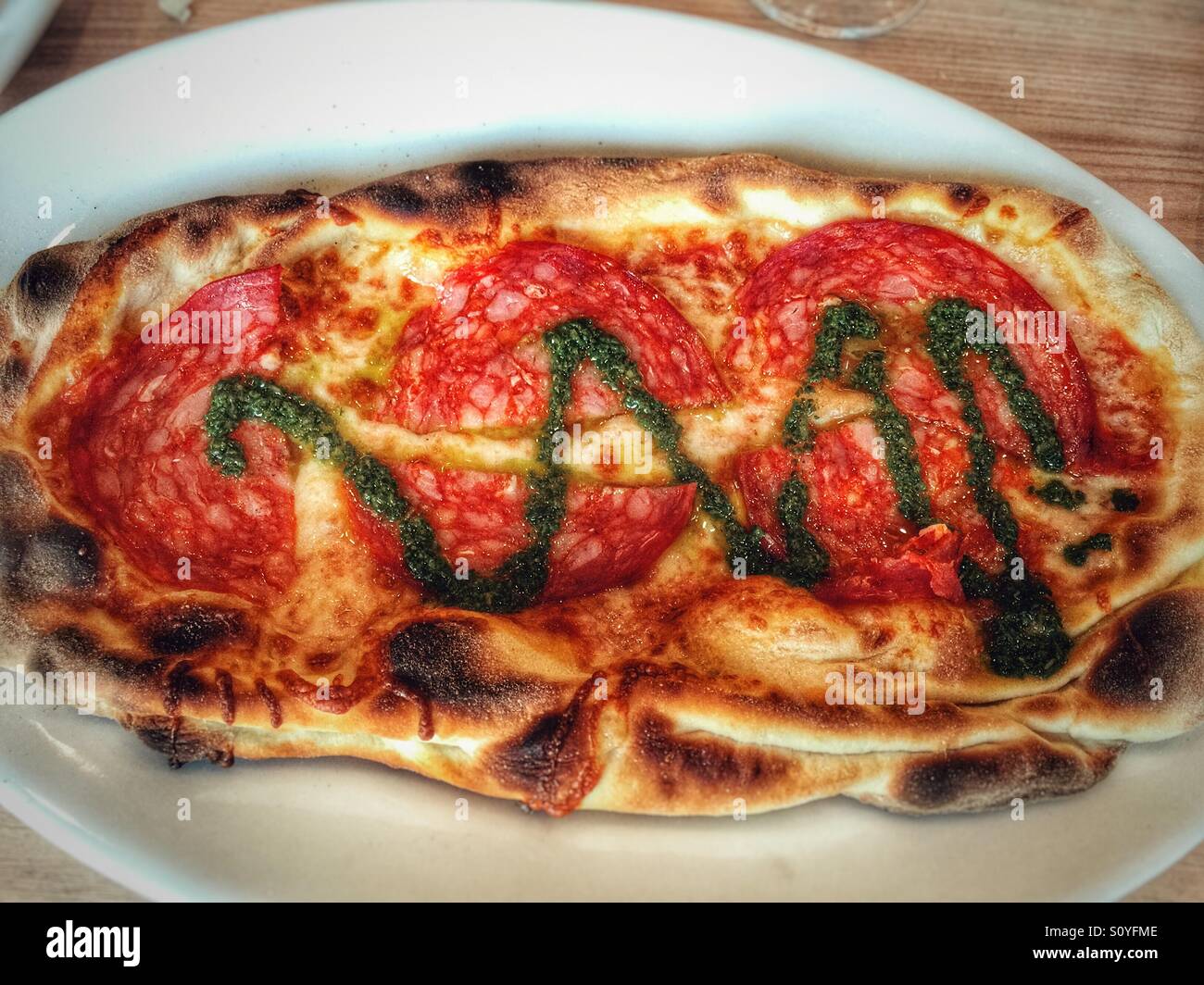 Small pizza with pepperoni Stock Photo - Alamy
