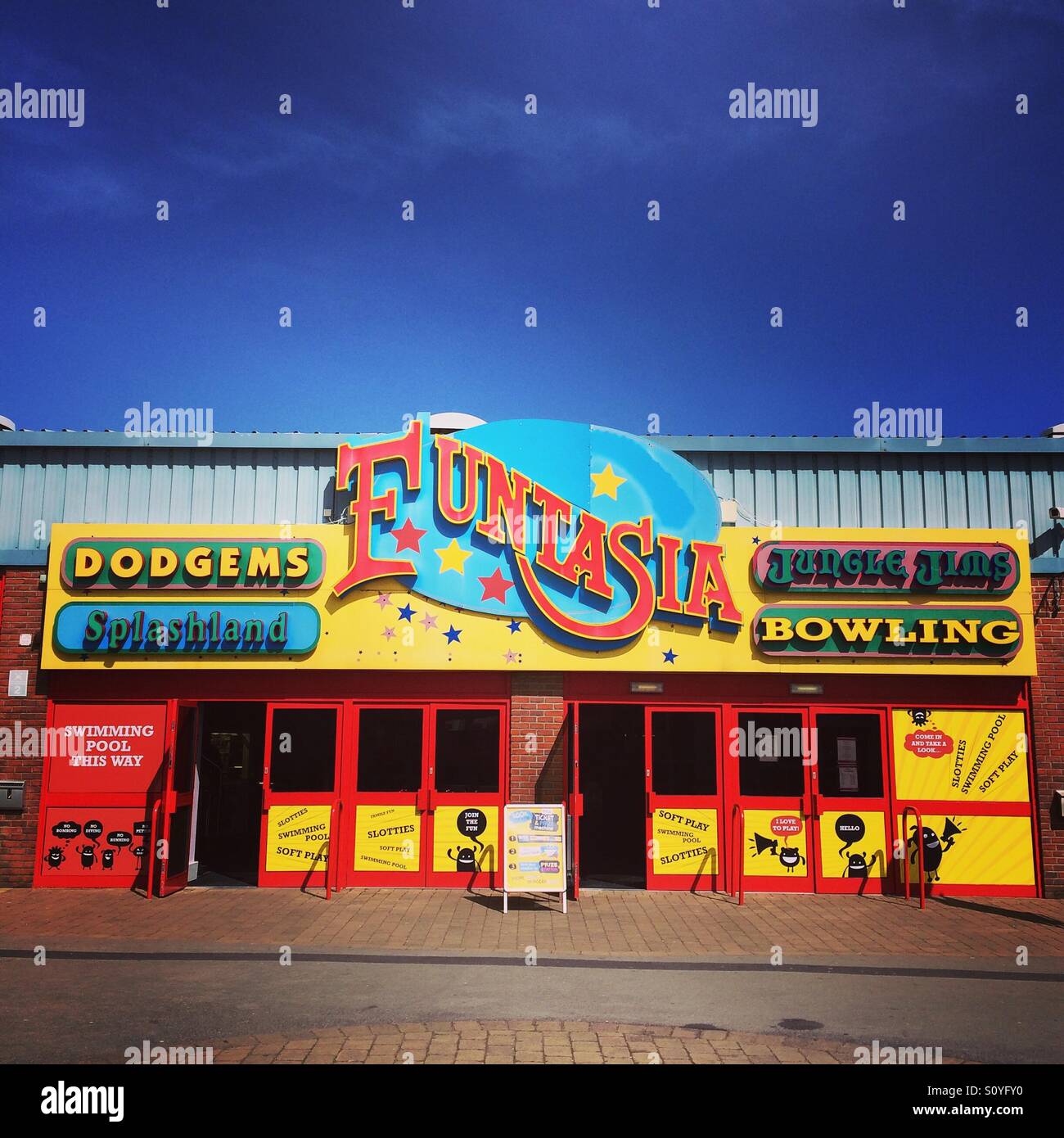 Colourful amusement arcade frontage at Trecco Bay, Porthcawl, Wales ...