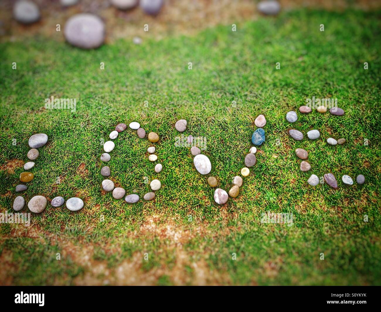 Love written with pebbles Stock Photo - Alamy